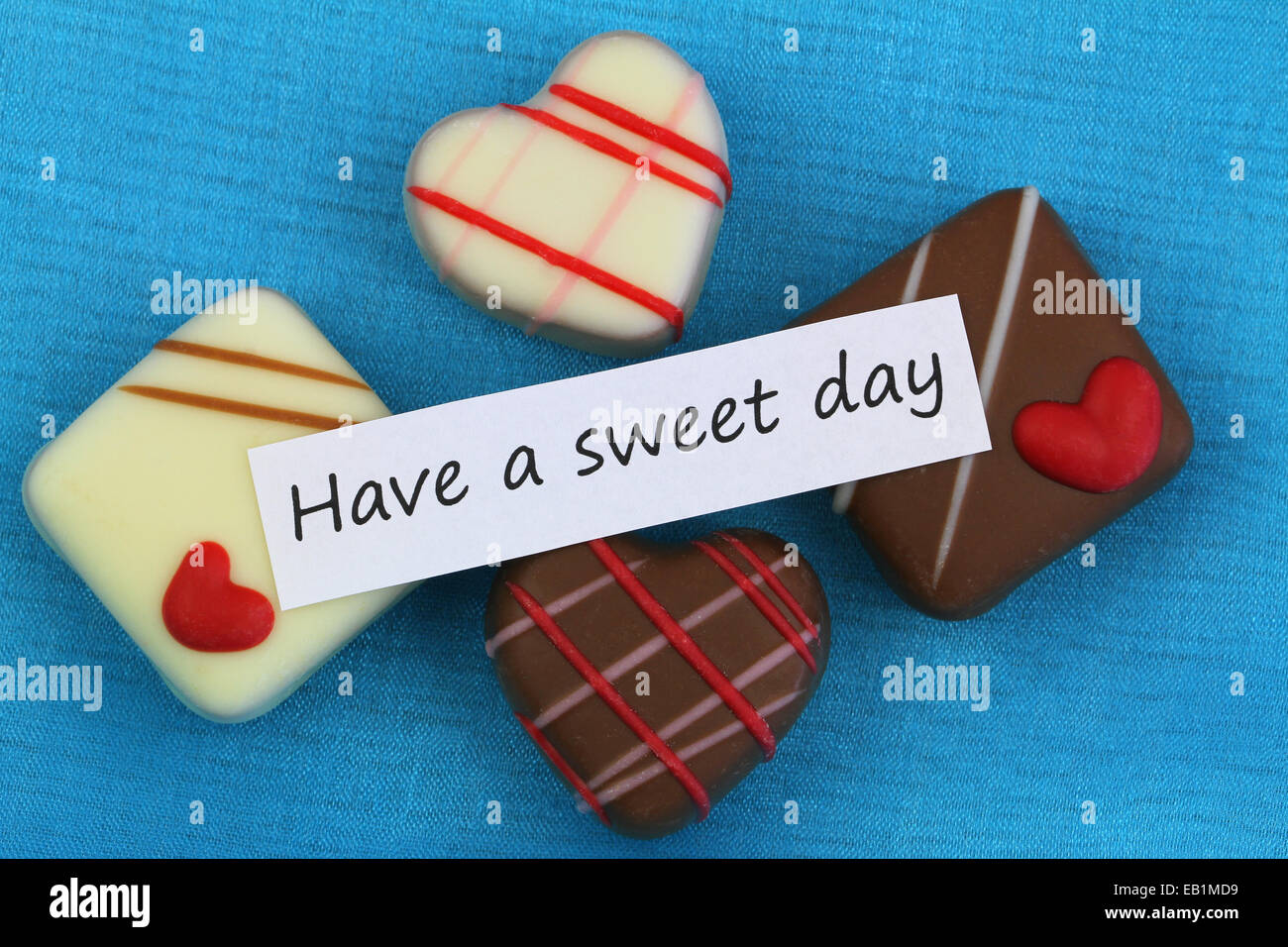 Have a sweet day card with assorted chocolates Stock Photo - Alamy