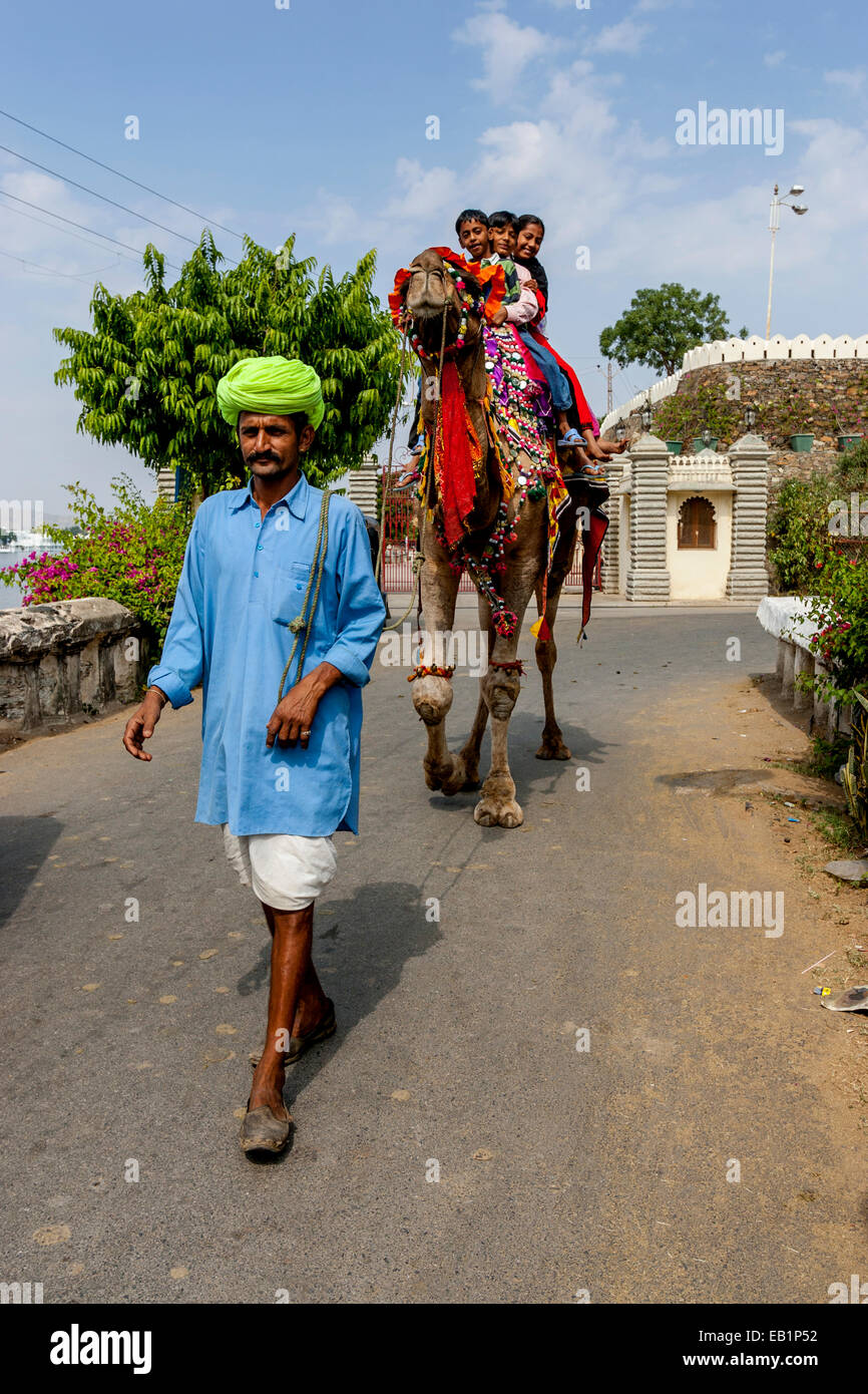 Indian children riding a camel hi-res stock photography and images - Alamy