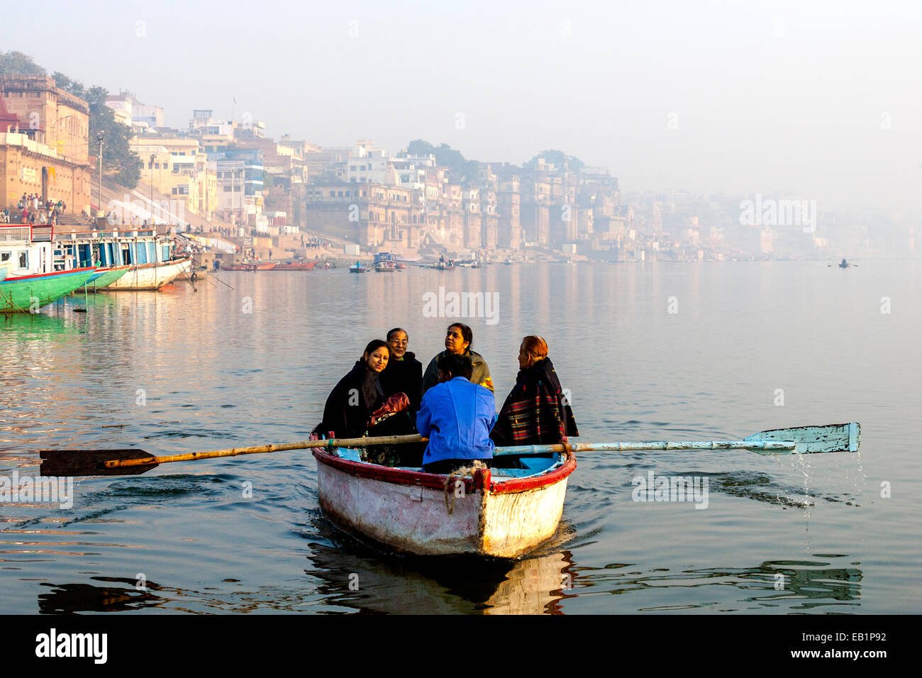 Hindu Pilgrims Take A Boat Ride On The Holy River Ganges, Varanasi ...