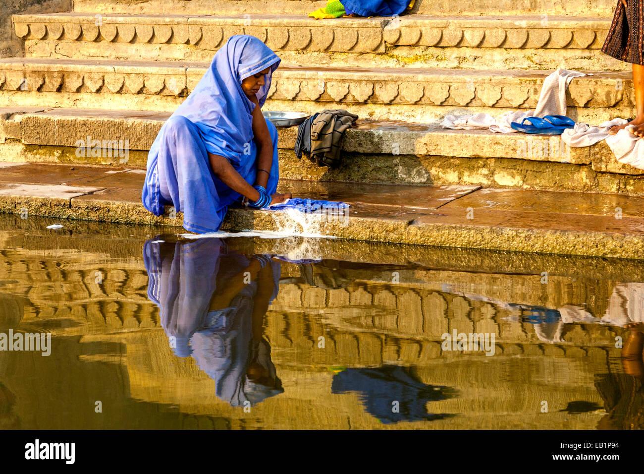 Woman Washing Clothes In The Holy River Ganges, Varanasi, Uttar Pradesh ...