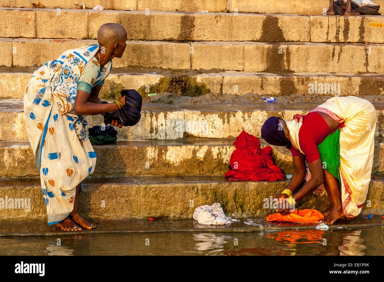 Women Washing Clothes In The Holy River Ganges, Varanasi, Uttar Pradesh ...