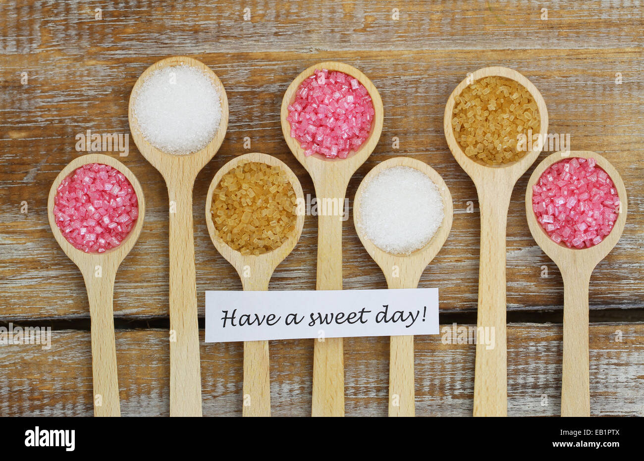 Have a sweet day card with pink and white sugar on wooden spoons Stock ...