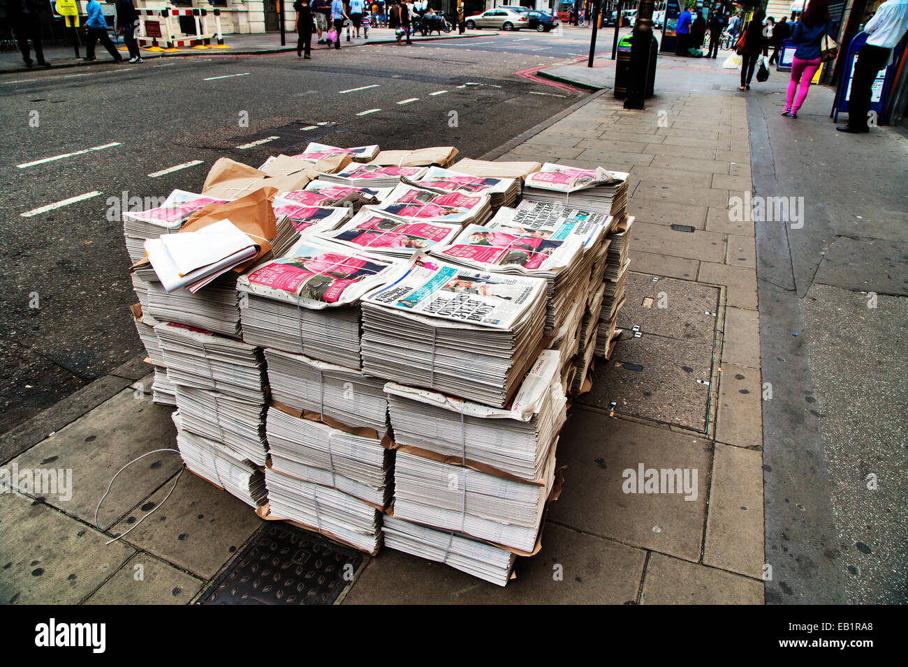 Massive stack of newspapers on pallet, Baker Street, London, England ...