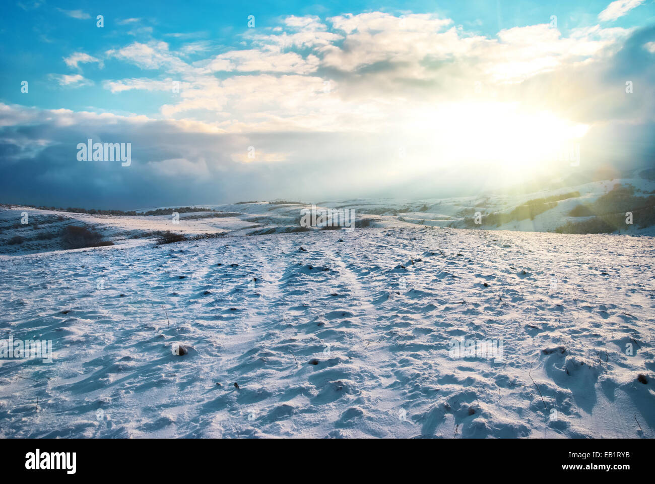 Winter hills covered by snow against sunset Stock Photo - Alamy