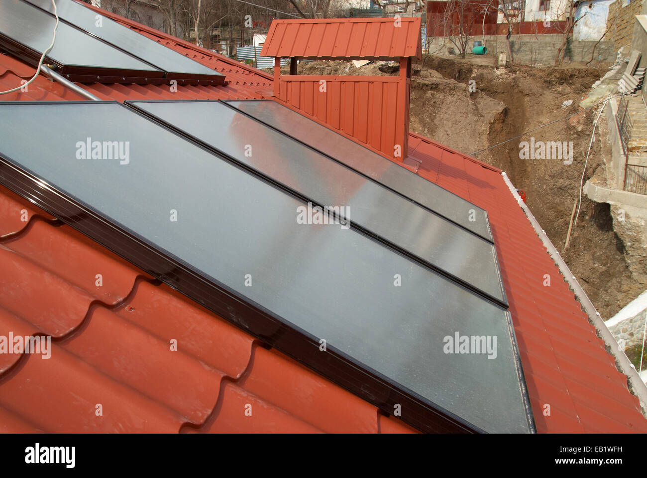 Solar water heating system on the red roof. Gelio panels Stock Photo ...