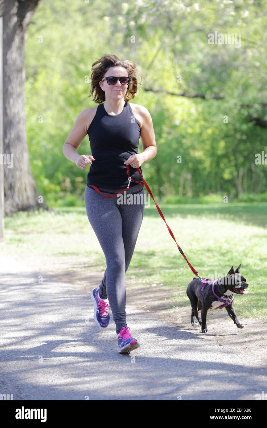 female woman running walk dog park outdoor summer Stock Photo - Alamy