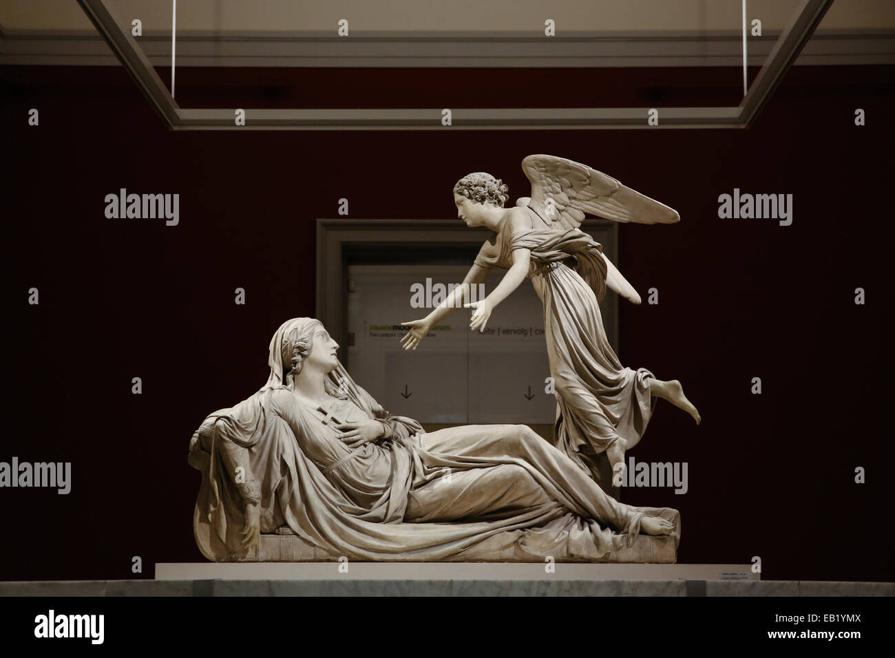 white sculptures woman lying ground angel Stock Photo - Alamy