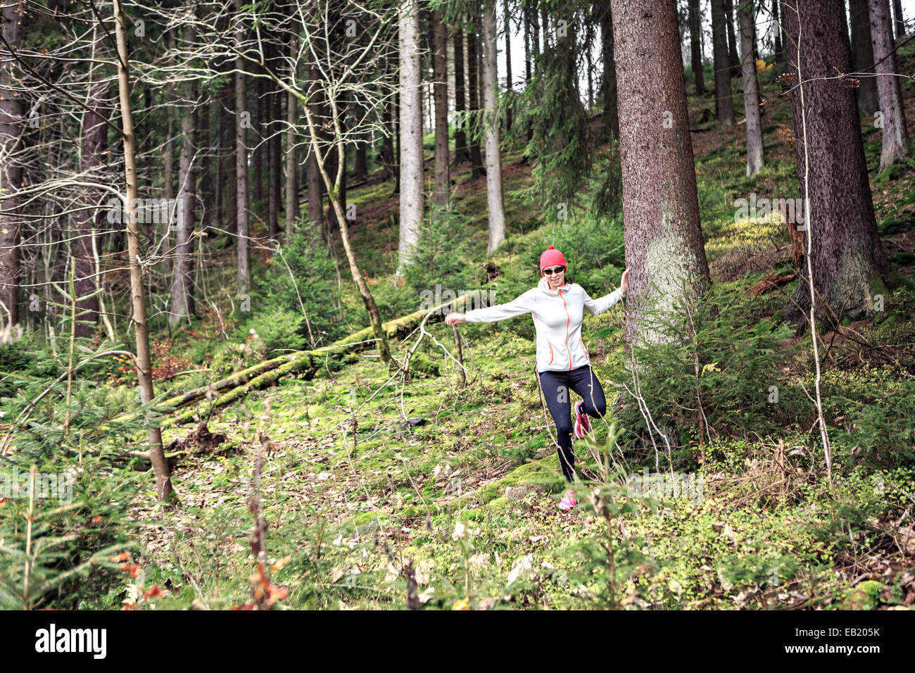 woman running through the forest by the lake Stock Photo - Alamy