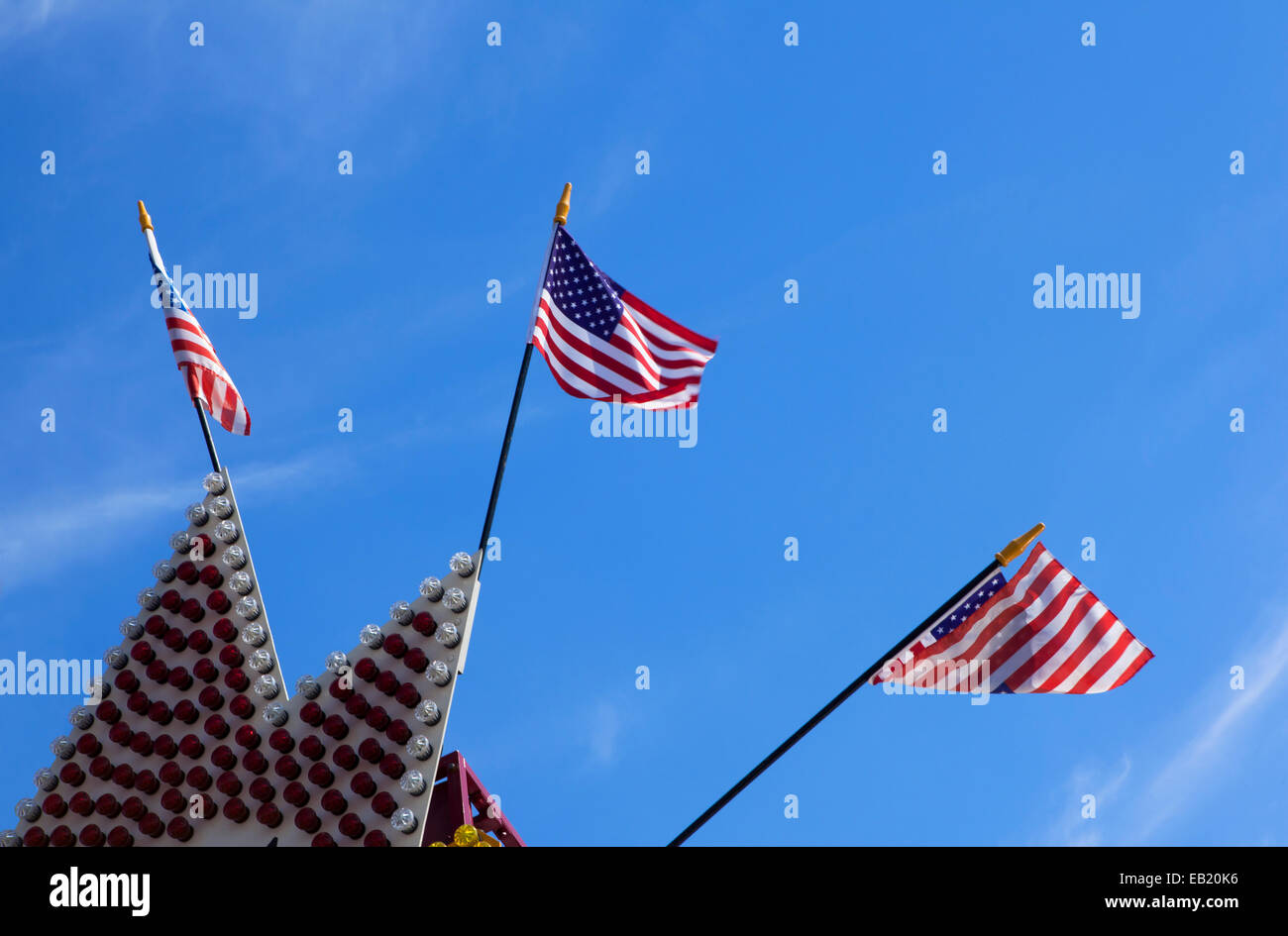 three American flags in a show booth at the amusement park Stock Photo ...