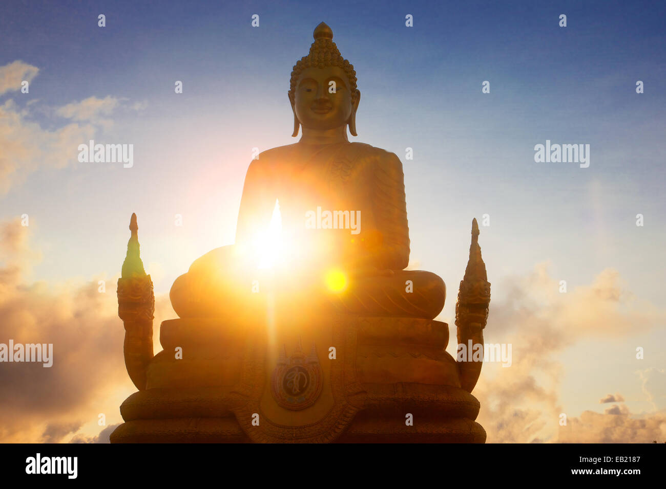 A back lite Buddha statue in Phuket, Thailand Stock Photo - Alamy