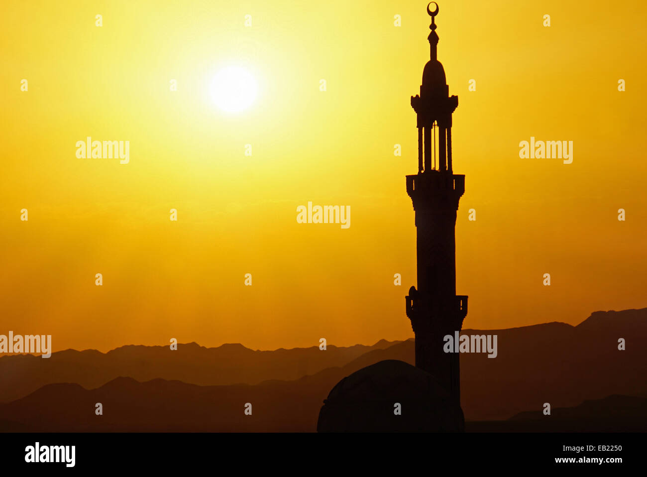 sunset over mosque in egypt Stock Photo - Alamy