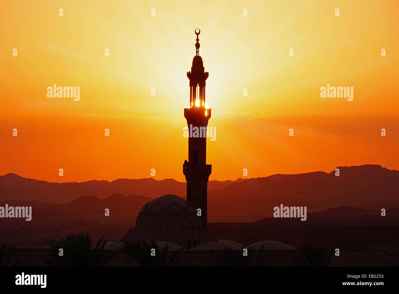 sunset over mosque in egypt Stock Photo - Alamy