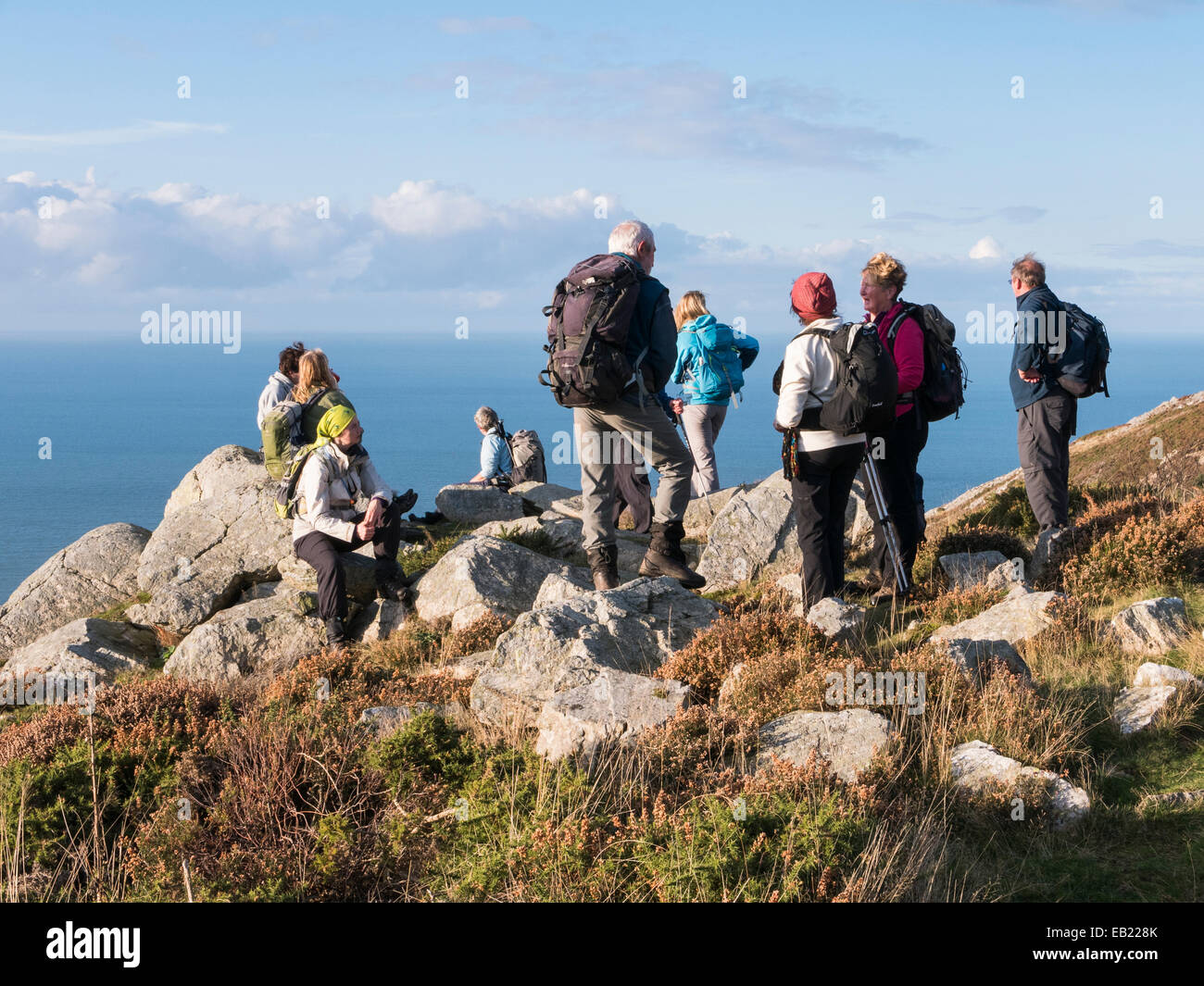 Group of Ramblers resting on Penmaenbach hill with a view of Welsh ...