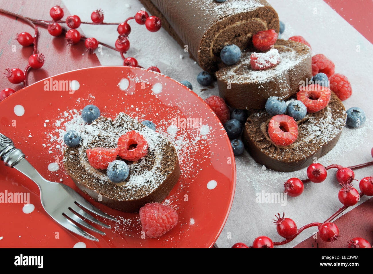 Christmas holiday chocolate roulade swiss roll with berries dessert ...