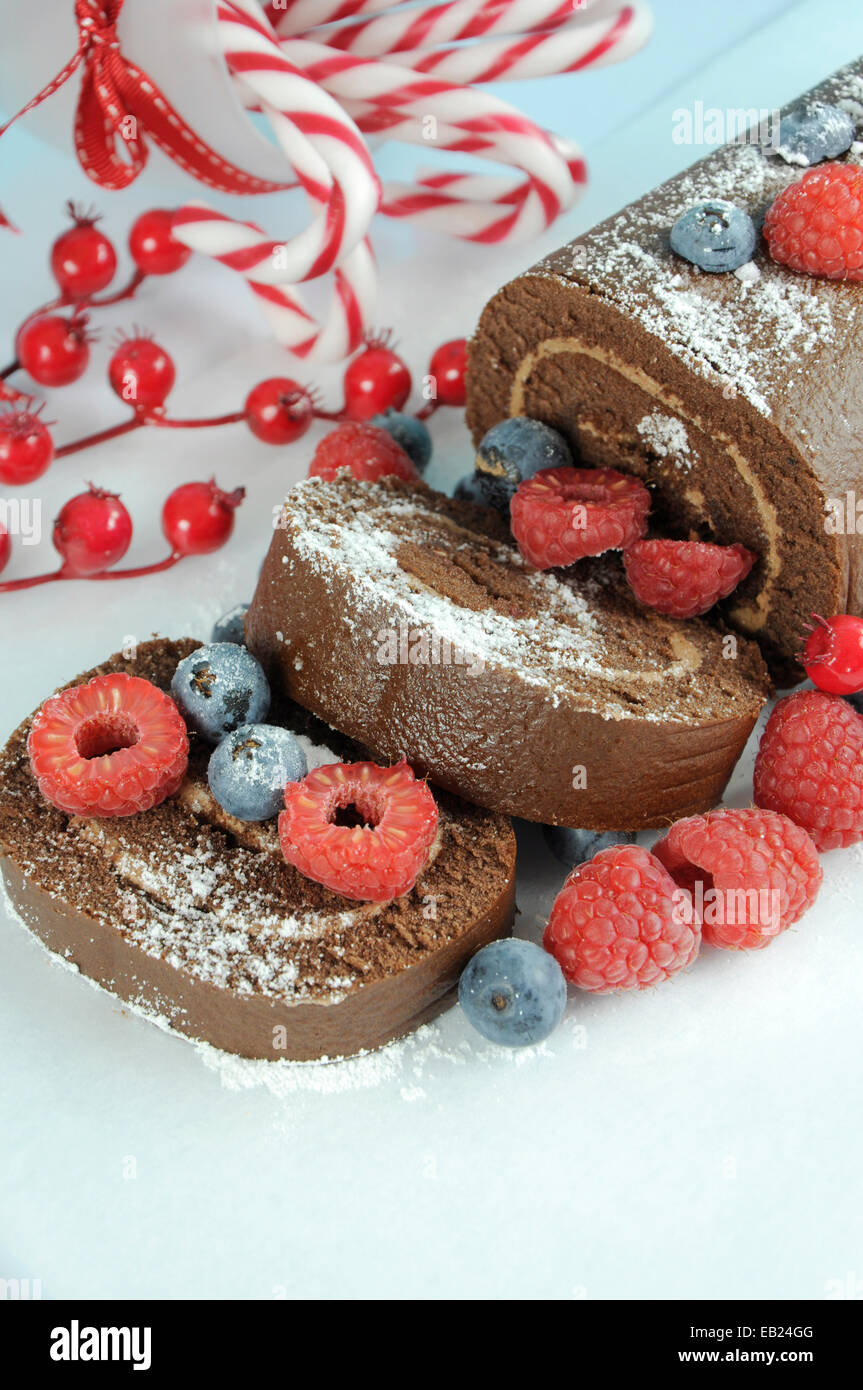 Christmas holiday chocolate roulade swiss roll with berries dessert ...