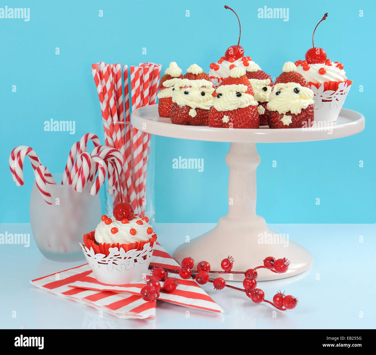 Christmas holiday dessert party food with cherry cupcakes and Santa ...
