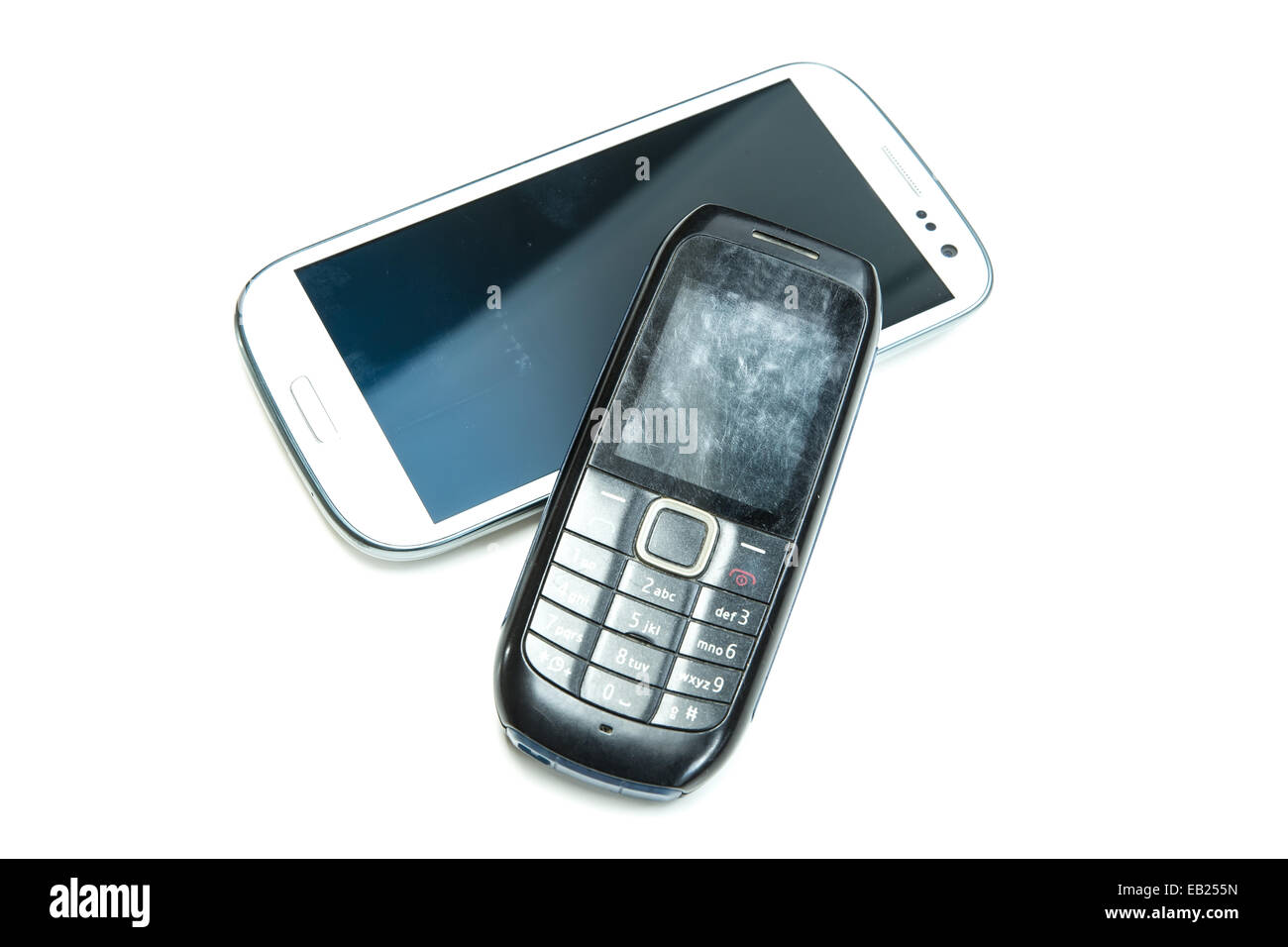 A modern smartphone and a old classic cell phone side by side Stock ...