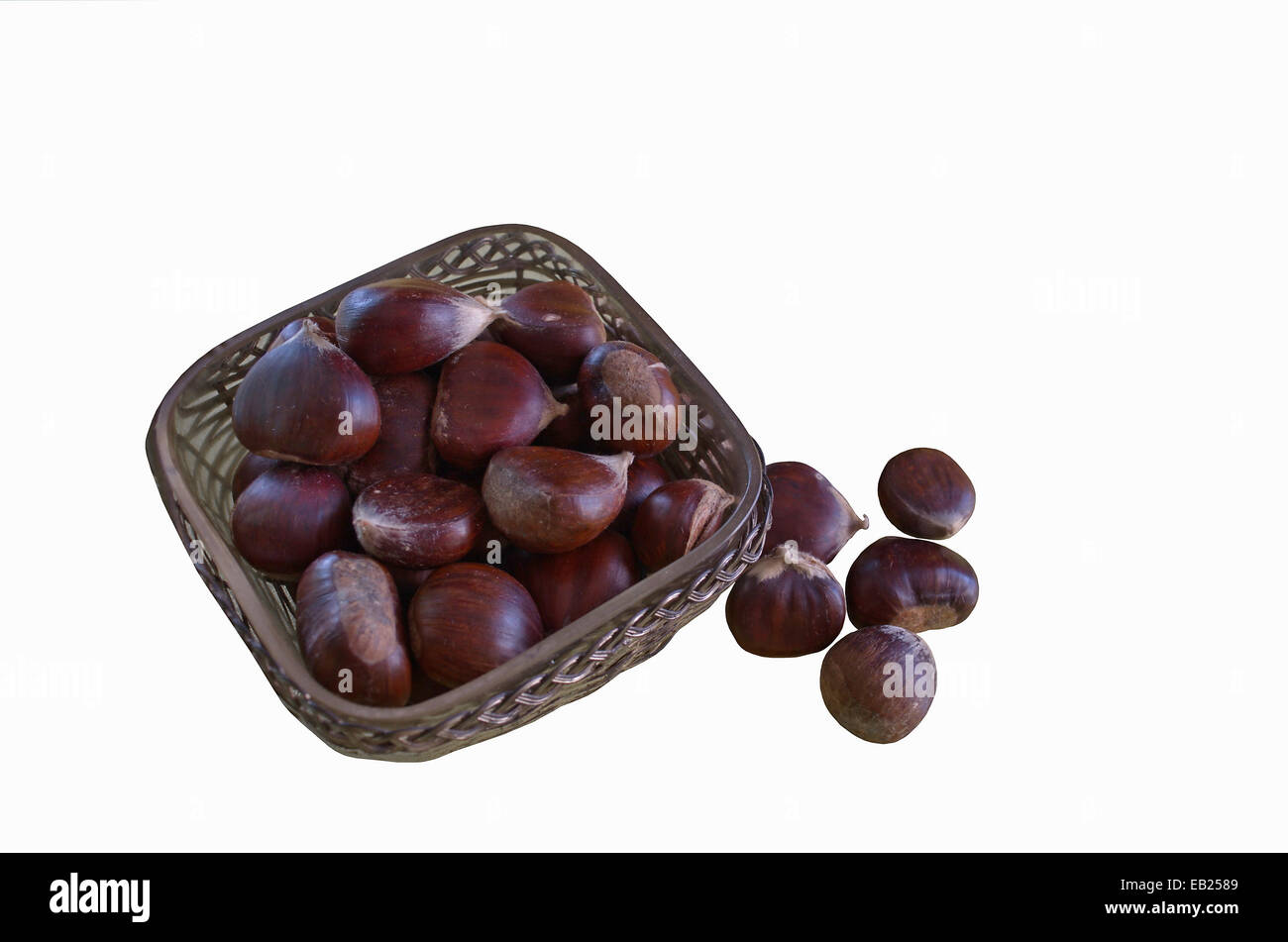 Fresh chestnut fruits in basket isolated on white Stock Photo - Alamy