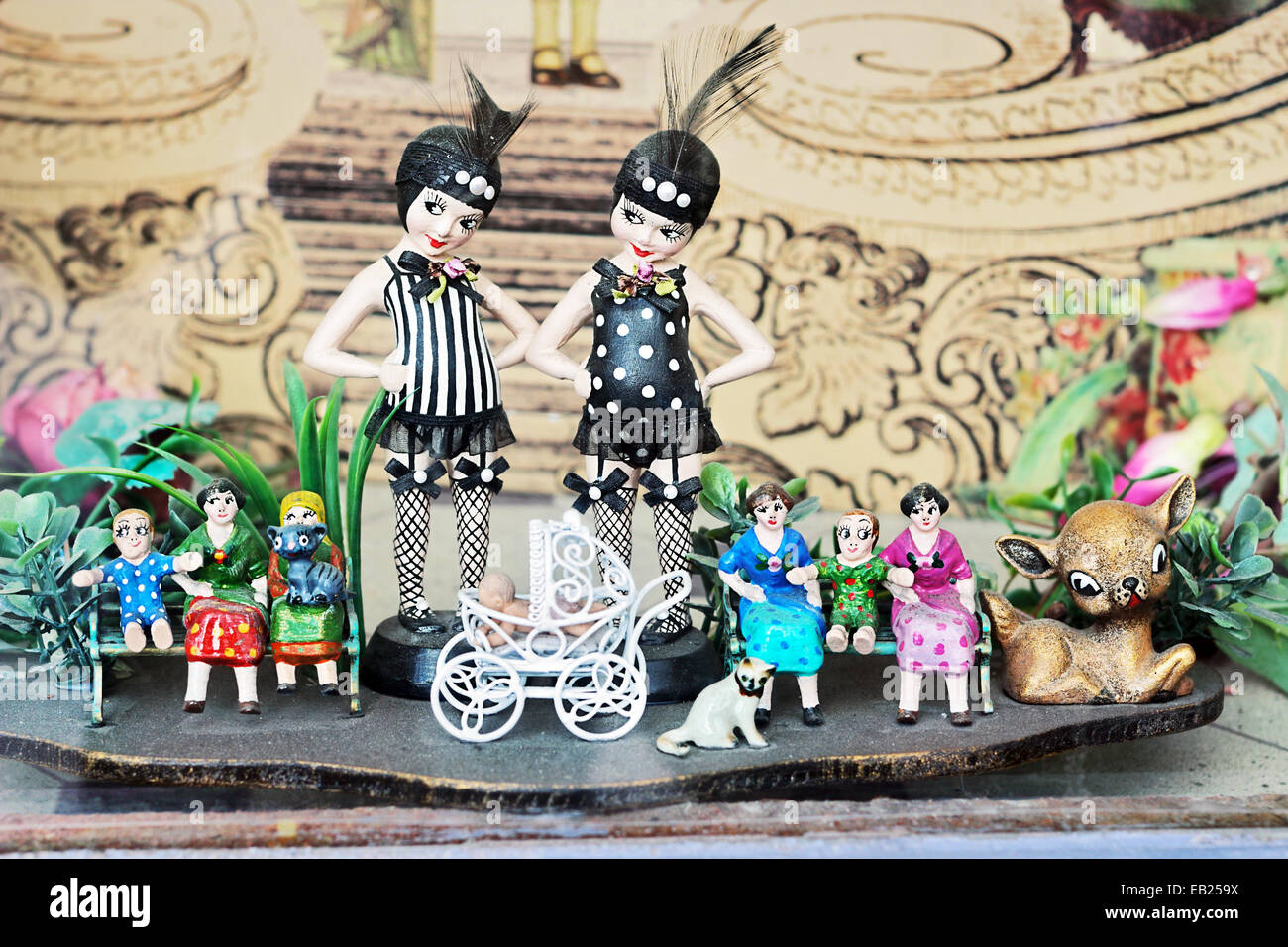 Action figures of people and scenes from the life in the window of a ...