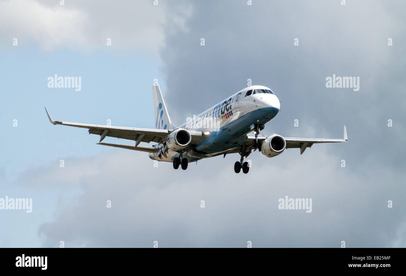 Flybe Embraer 175 landing to Manchester International Airport Stock ...