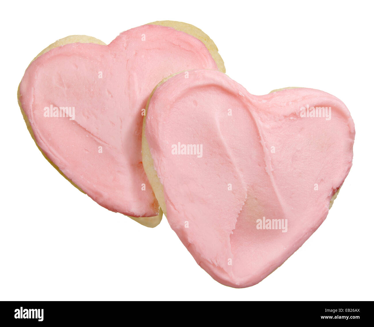 two heart sugar cookies iced with pink royal icing photographed on a ...