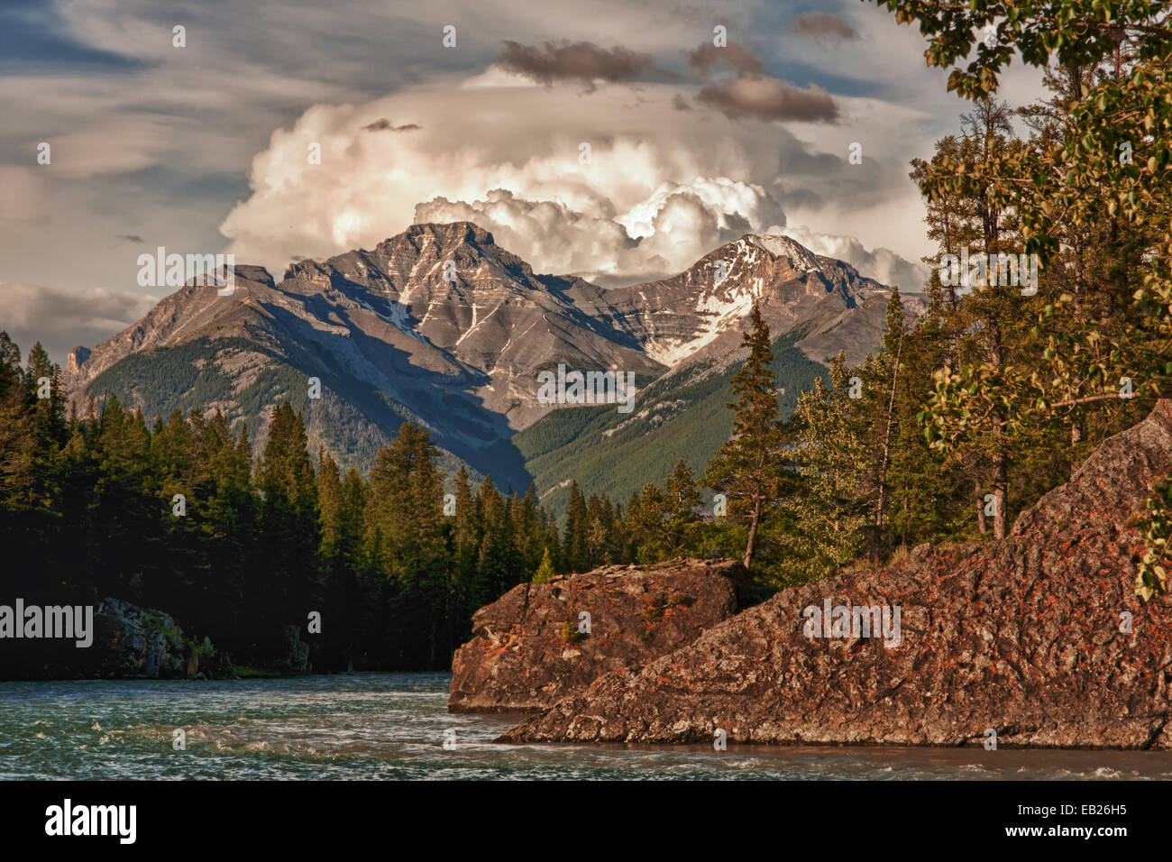 A storm gathers over the mountains at sunset in Banff - Canada Stock ...