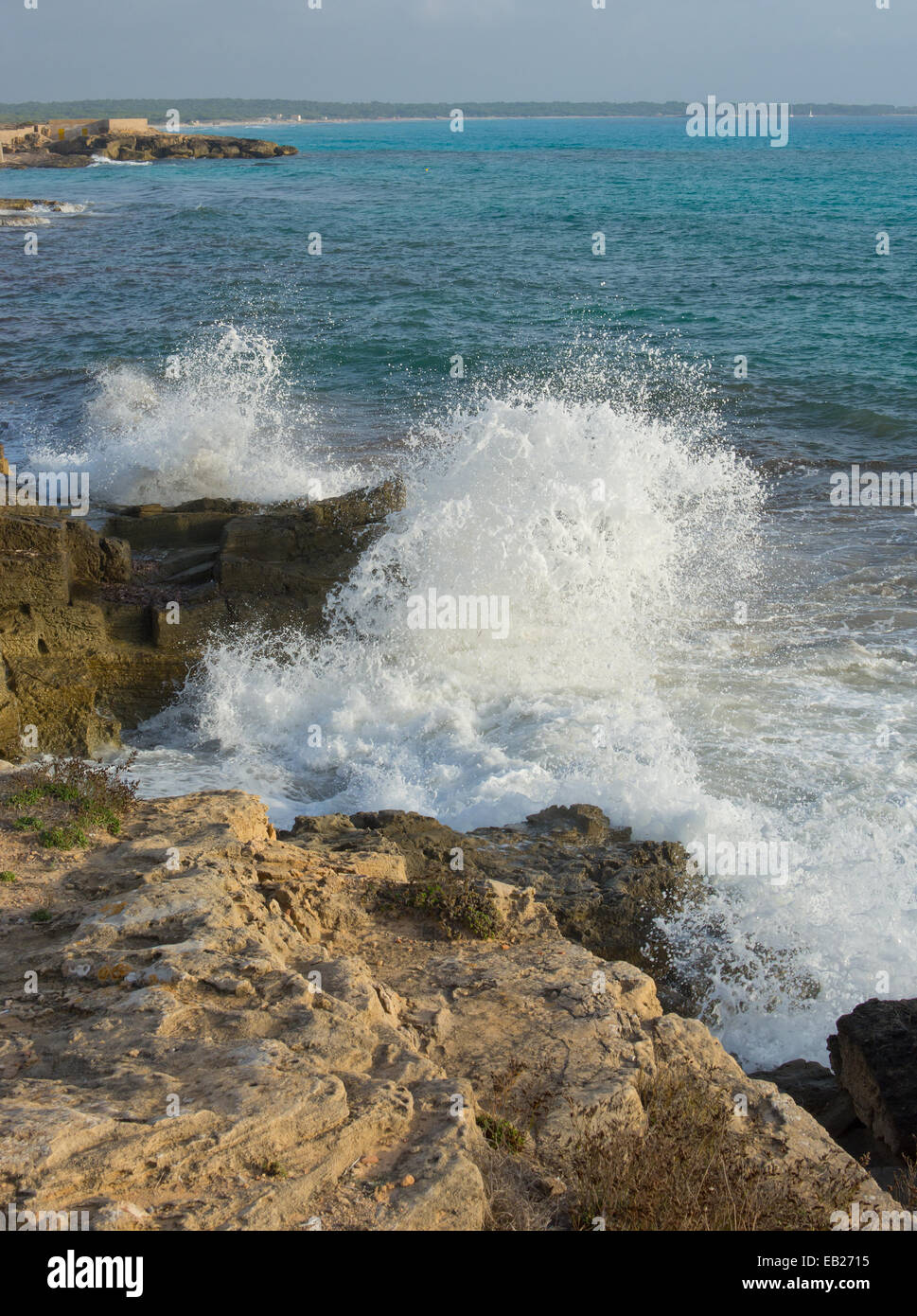 Wave power. Wave spraying on shore at Ses Covetes, Mallorca, Balearic ...