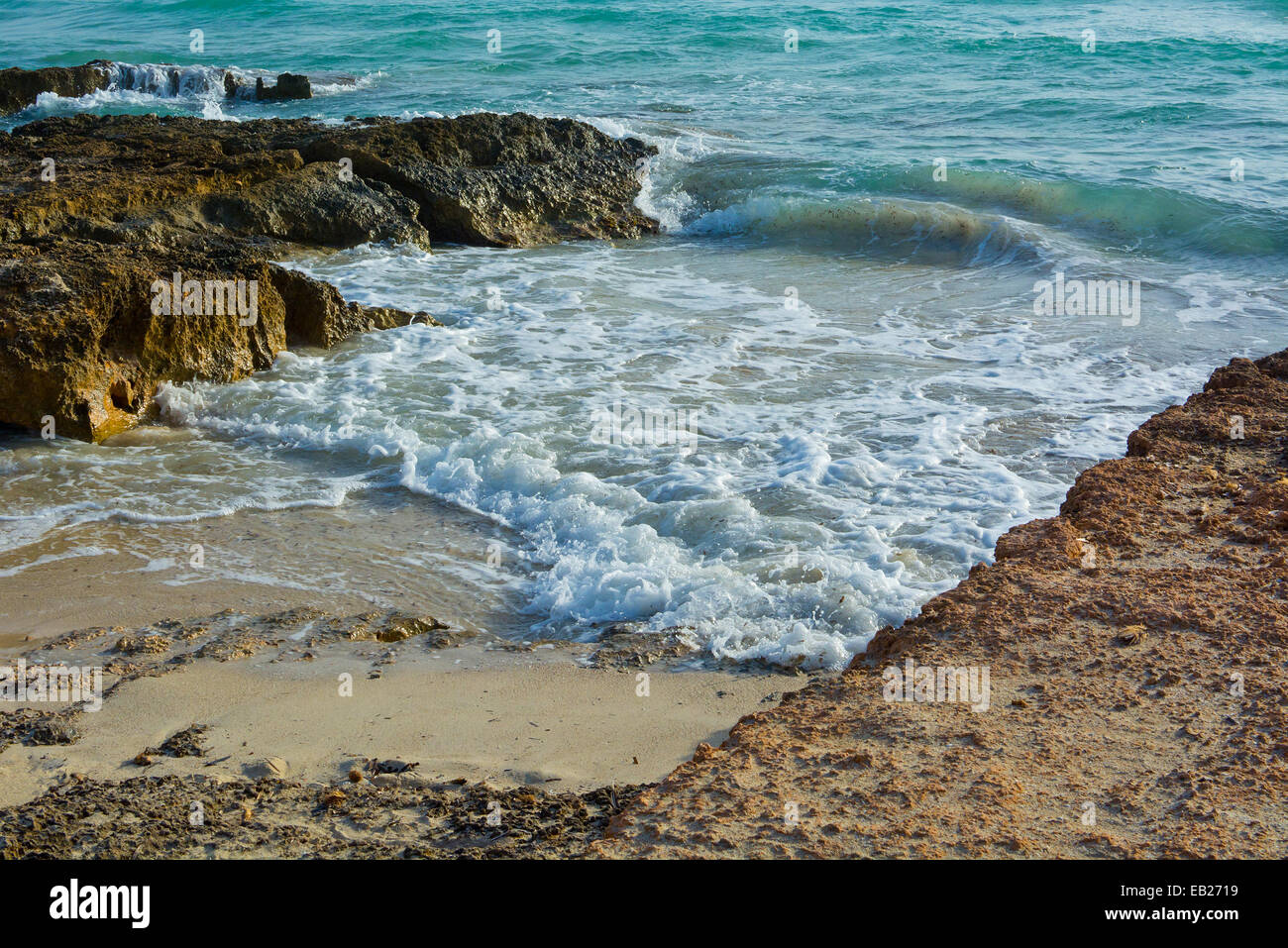 Ocean inlet with limestone rocks and turquoise Mediterranean water ...
