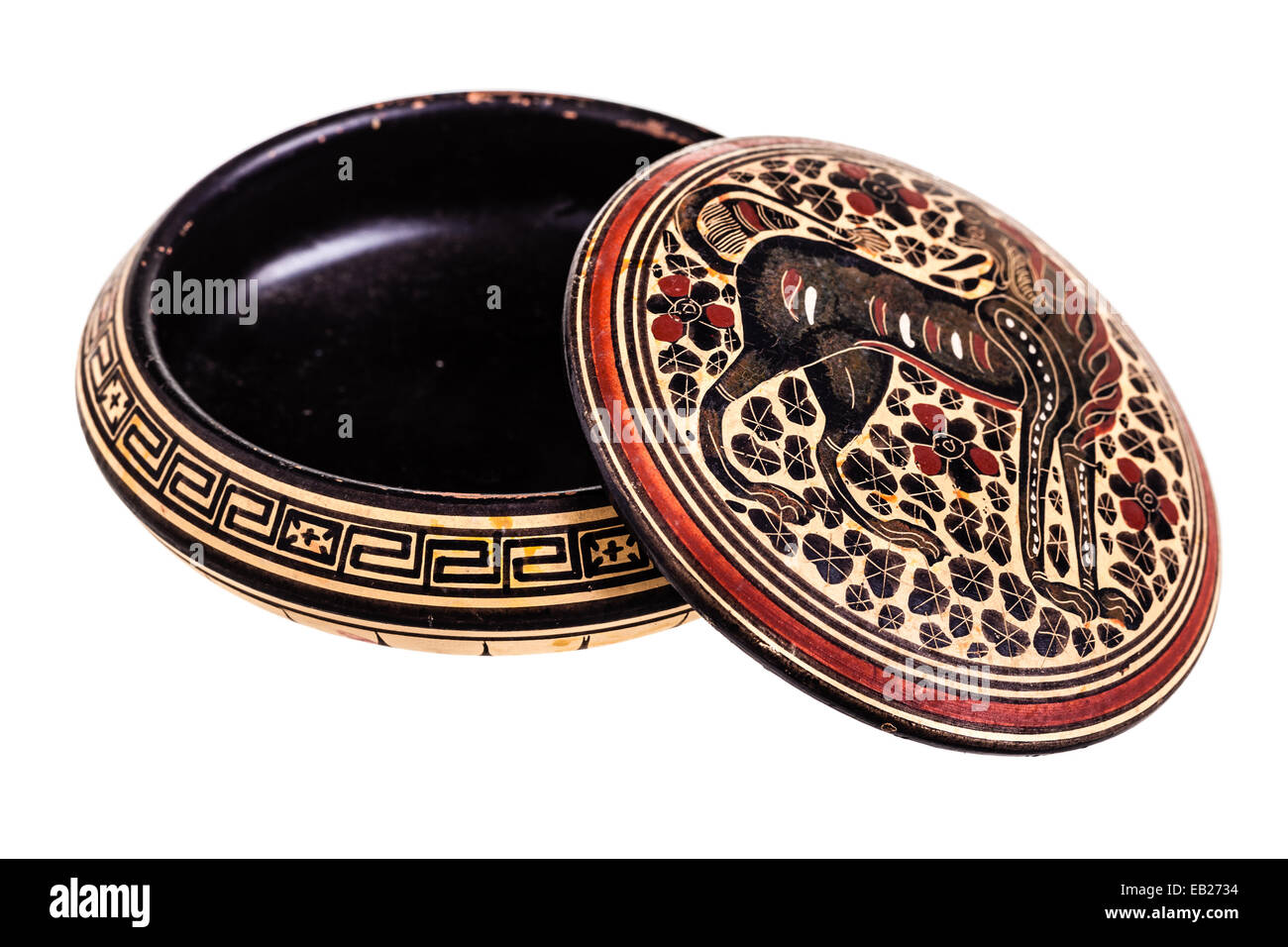 a small round ancient decorated ceramic box isolated over a white ...