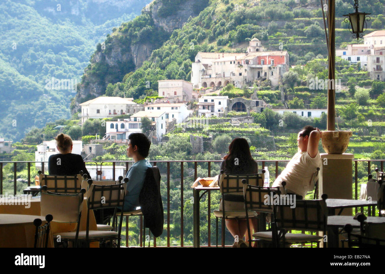 Diners relax and enjoy the view at a restaurant in Ravello, Italy Stock ...