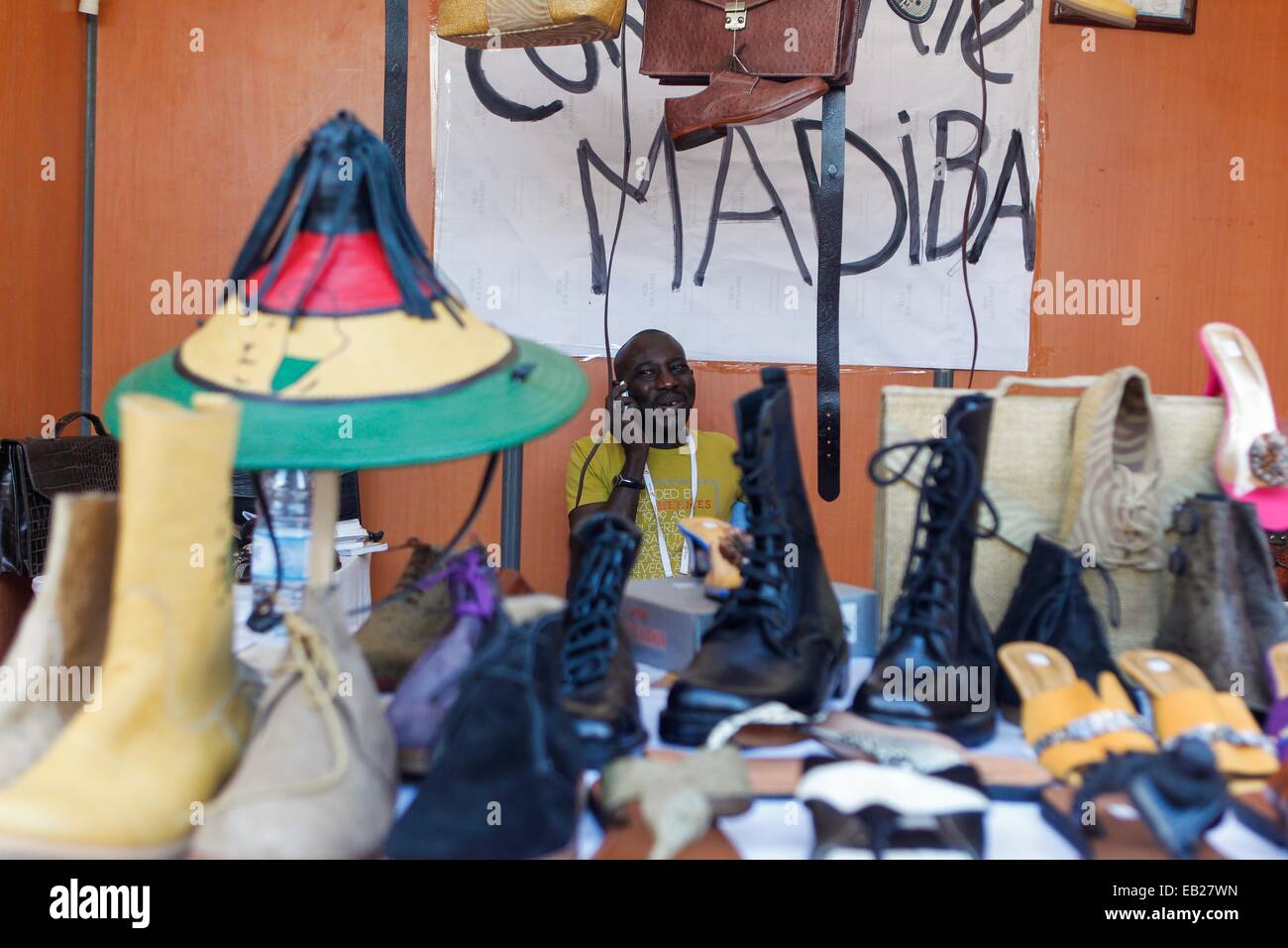 Dakar, Senegal. 24th Nov, 2014. An exhibitor waits for customers at his ...