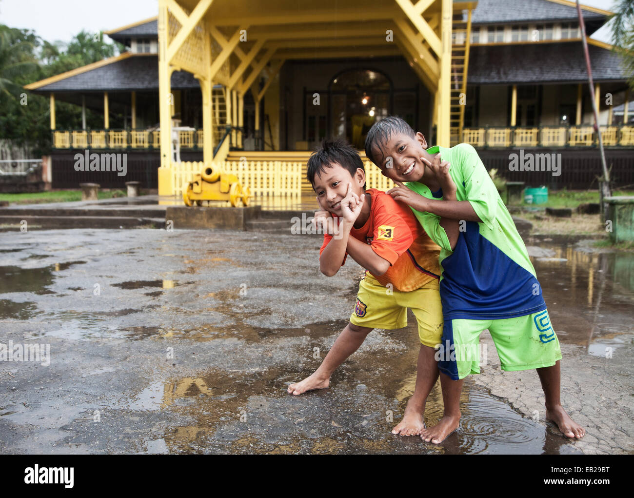 Candid portrait photograph of smiling Indonesian children having fun ...