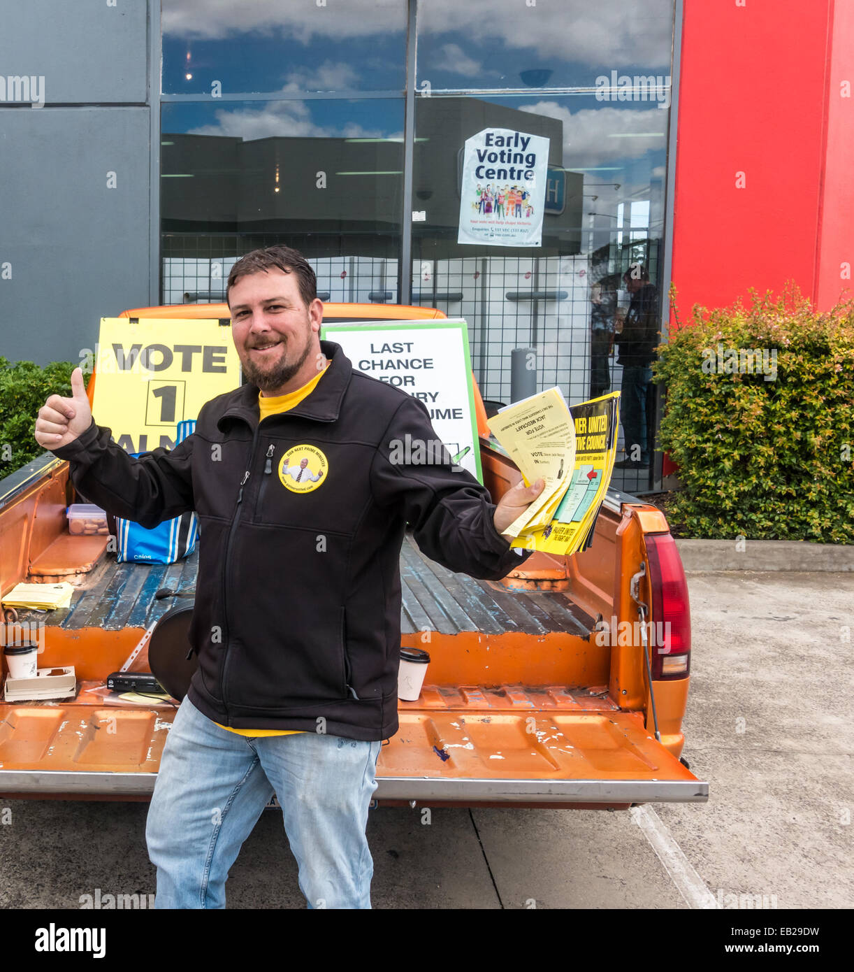 Election candidate handing out how to vote cards in Victoria's 2014 ...