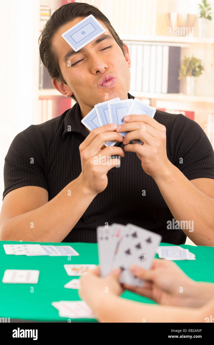 young man playing cards cuarenta traditional Ecuadorian game Stock ...