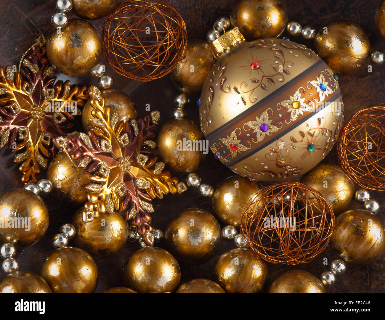 A rich and elegant image of golden Christmas tree ornaments and beaded ...