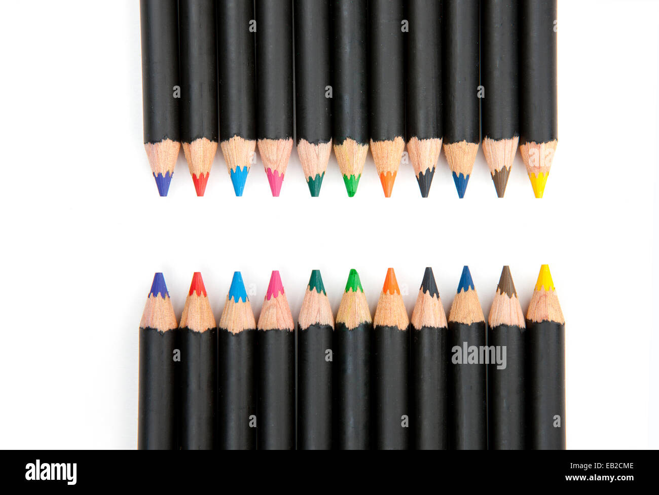 Pencils opposite each other Stock Photo - Alamy