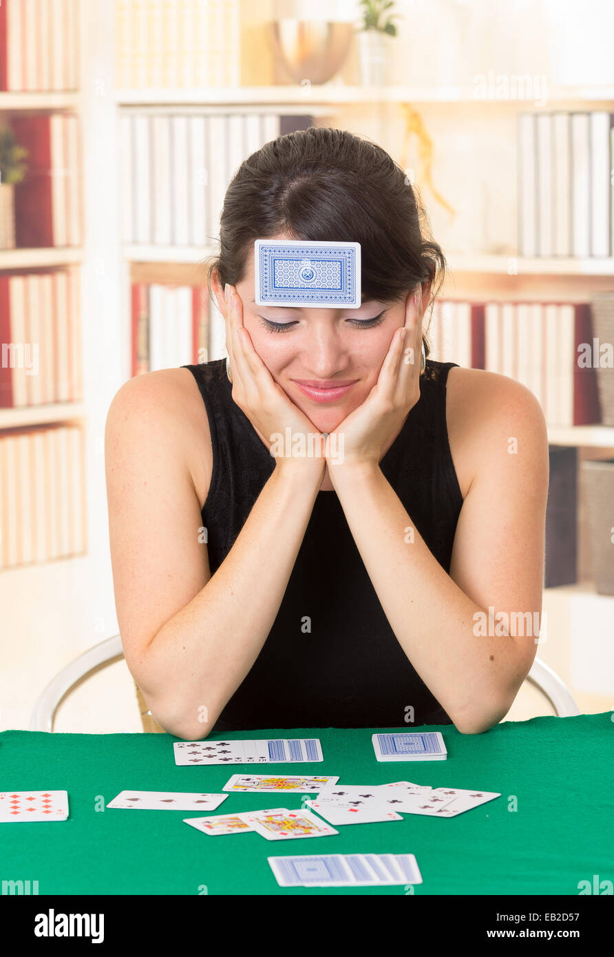 Young beautiful girl playing cards Stock Photo - Alamy
