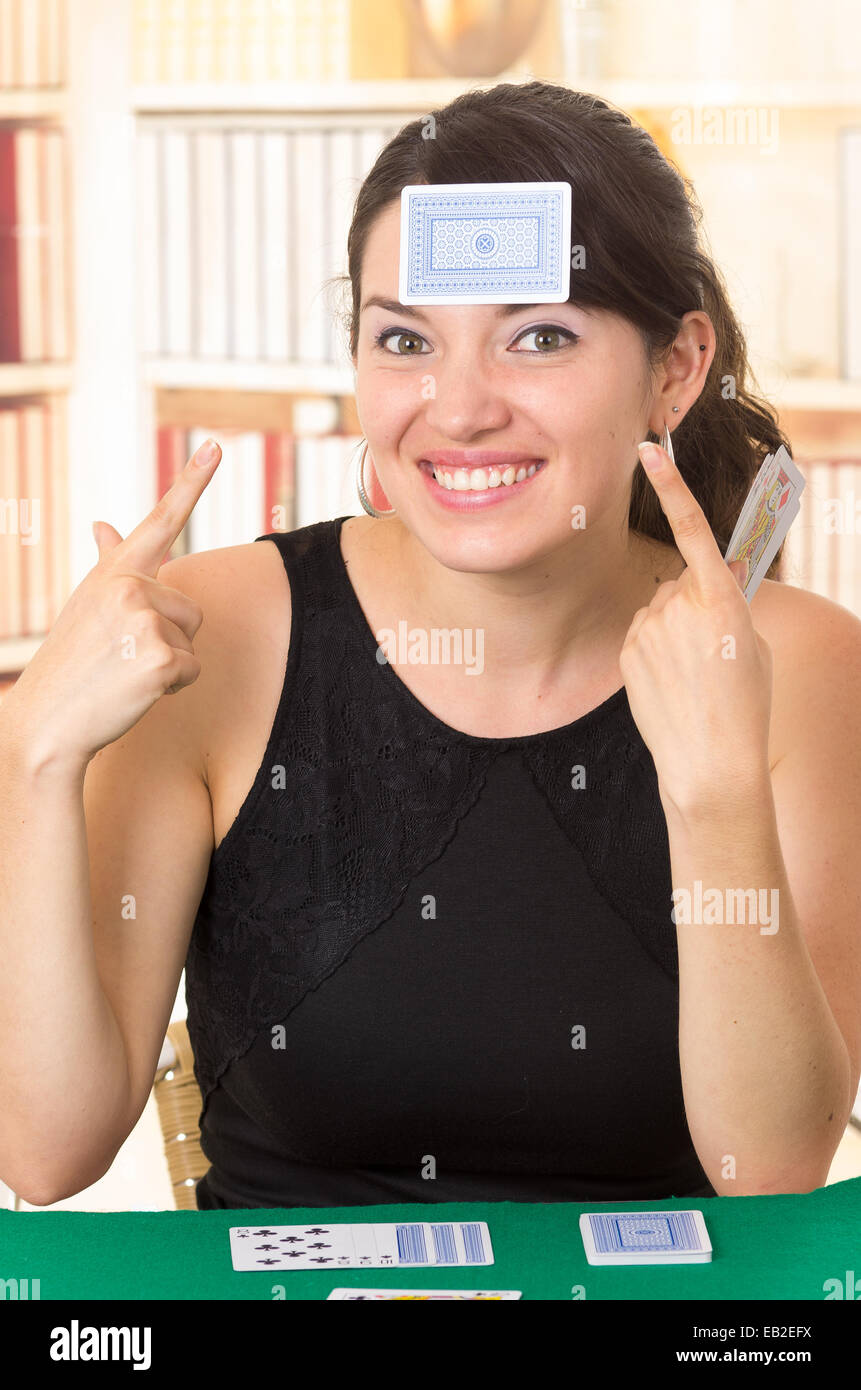 Young beautiful girl playing cards Stock Photo - Alamy