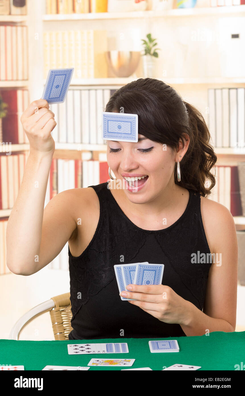 Young beautiful girl playing cards Stock Photo - Alamy