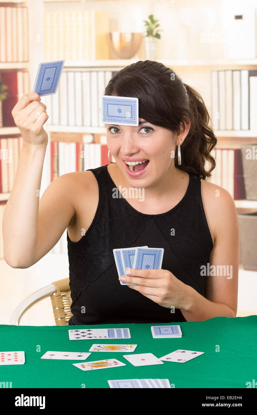 Young beautiful girl playing cards Stock Photo - Alamy