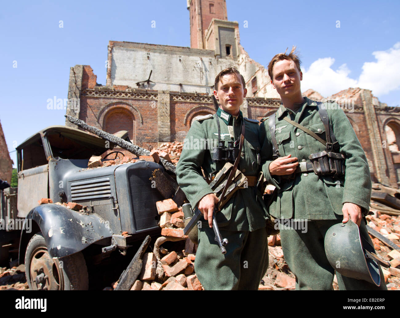 Actors Tom Schilling (R) and Volker Bruch as pose during the filming of ...