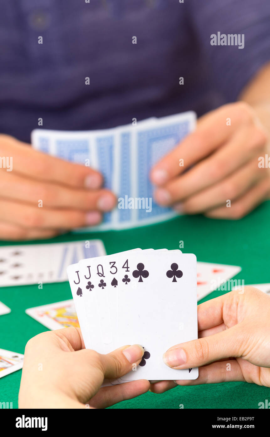 Playing cards closeup of hands holding deck Stock Photo - Alamy