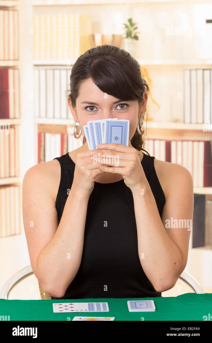 Young beautiful girl playing cards Stock Photo - Alamy
