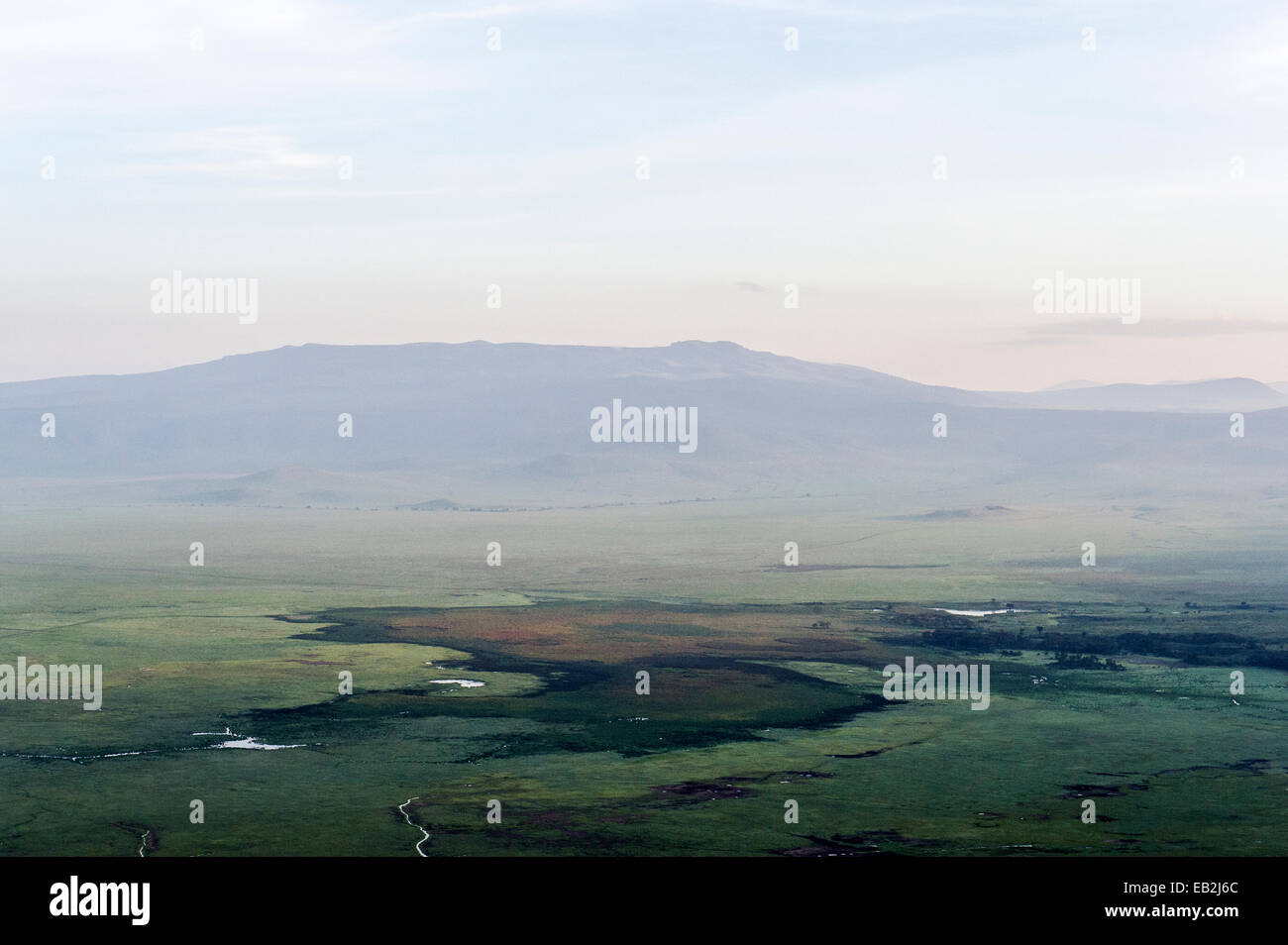 The lush savannah plain of an extinct volcano surrounded by a caldera ...
