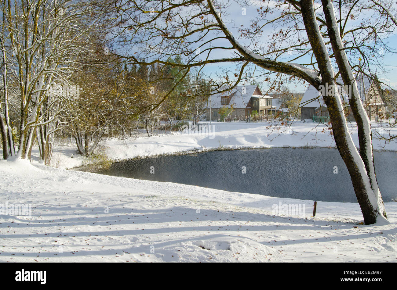 Autumn landscape with snow by a pond in rural Stock Photo - Alamy