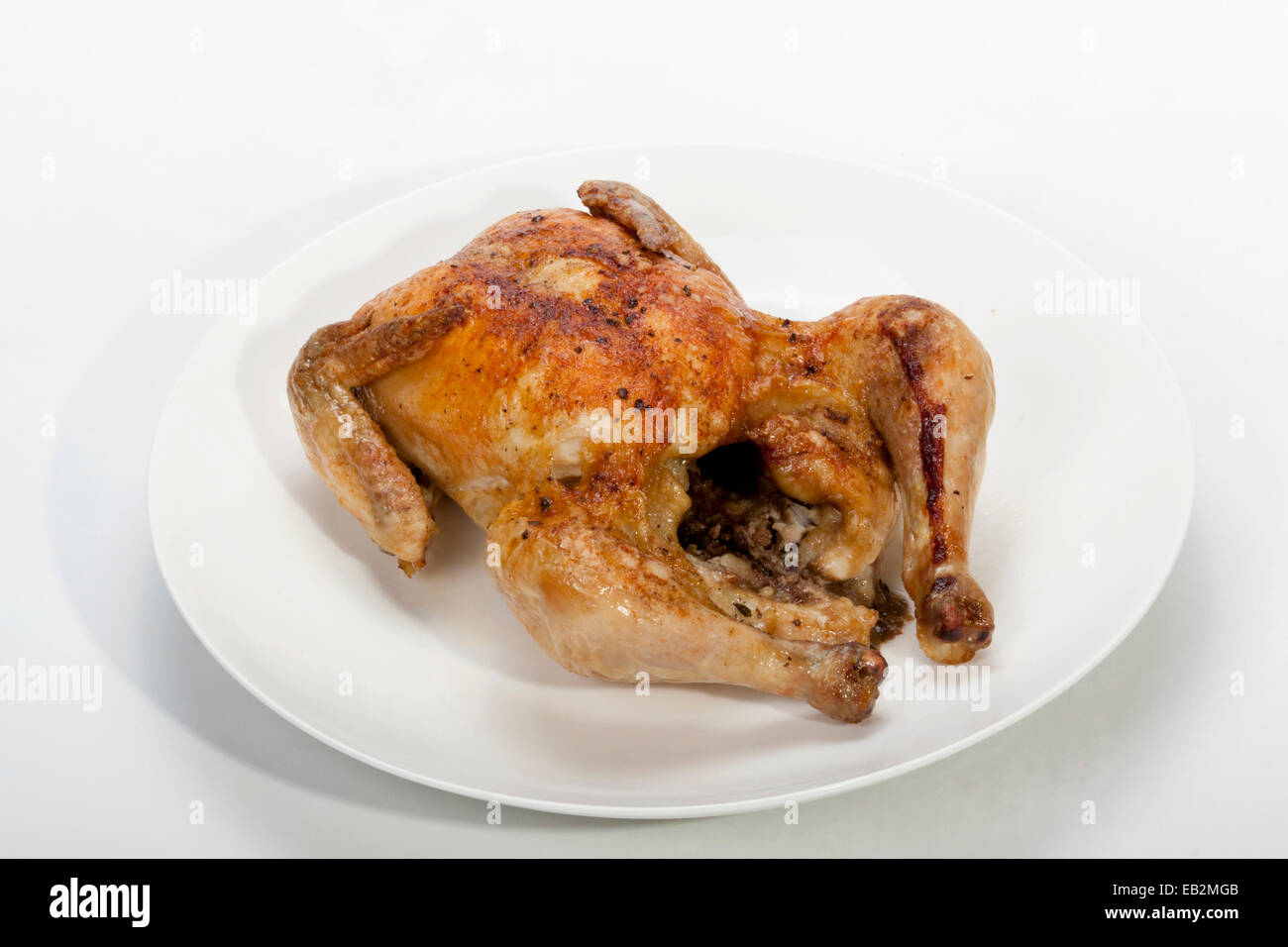 crispy roast chicken on clear white plate Stock Photo - Alamy