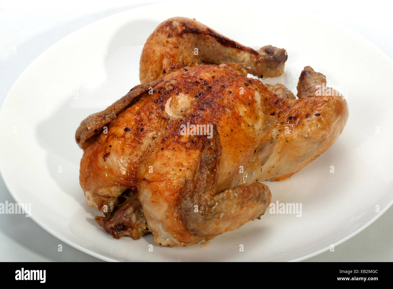 fresh crispy roast chicken on white plate Stock Photo - Alamy