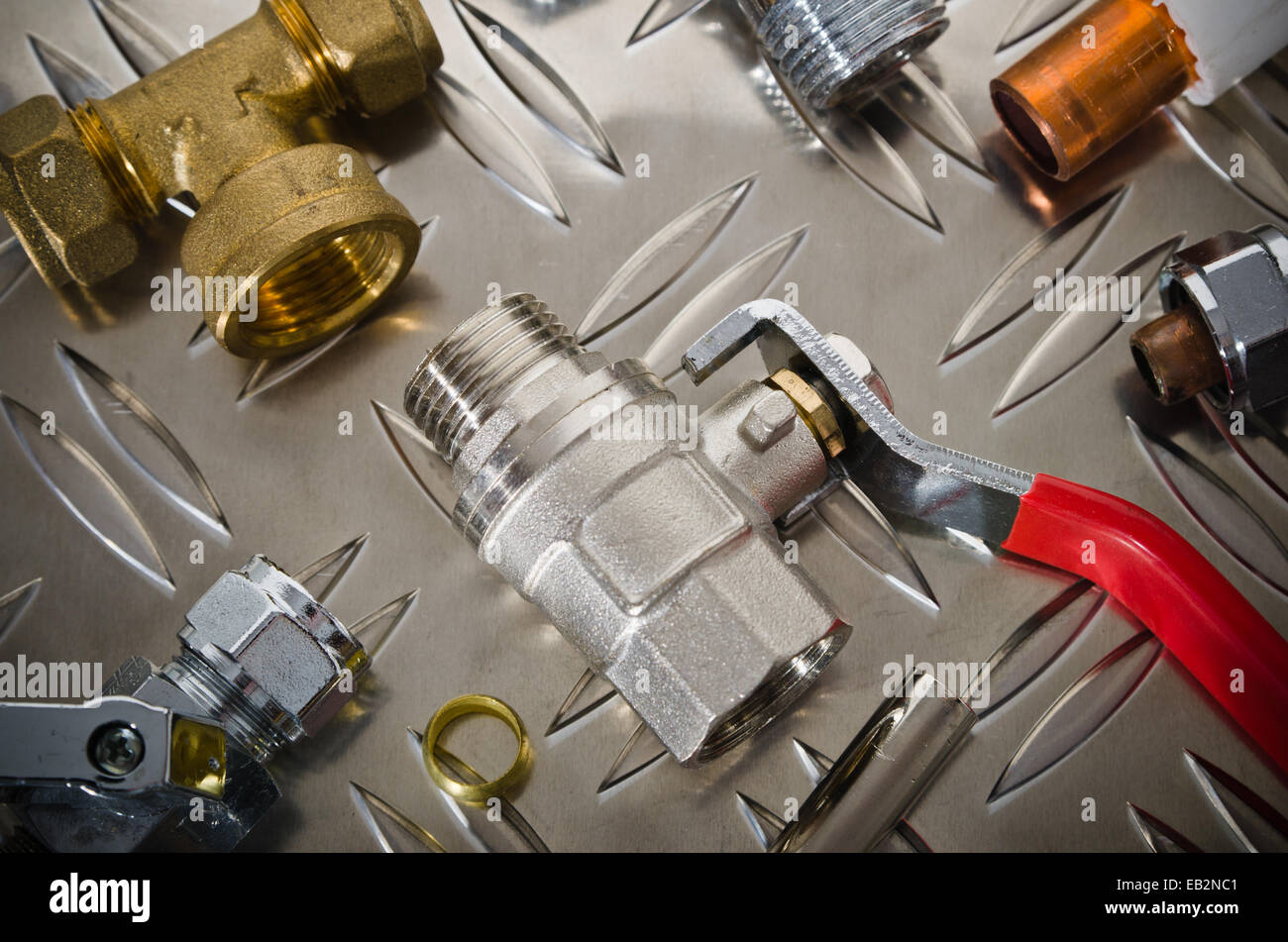 Plumbing inlet pipe valve on a metal surface Stock Photo - Alamy