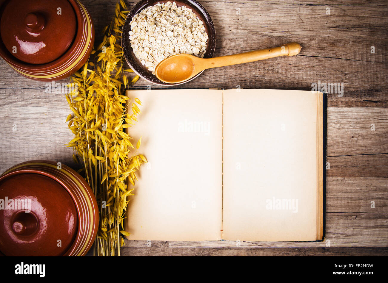 Oatmeal and an old recipe book on the kitchen table Stock Photo - Alamy