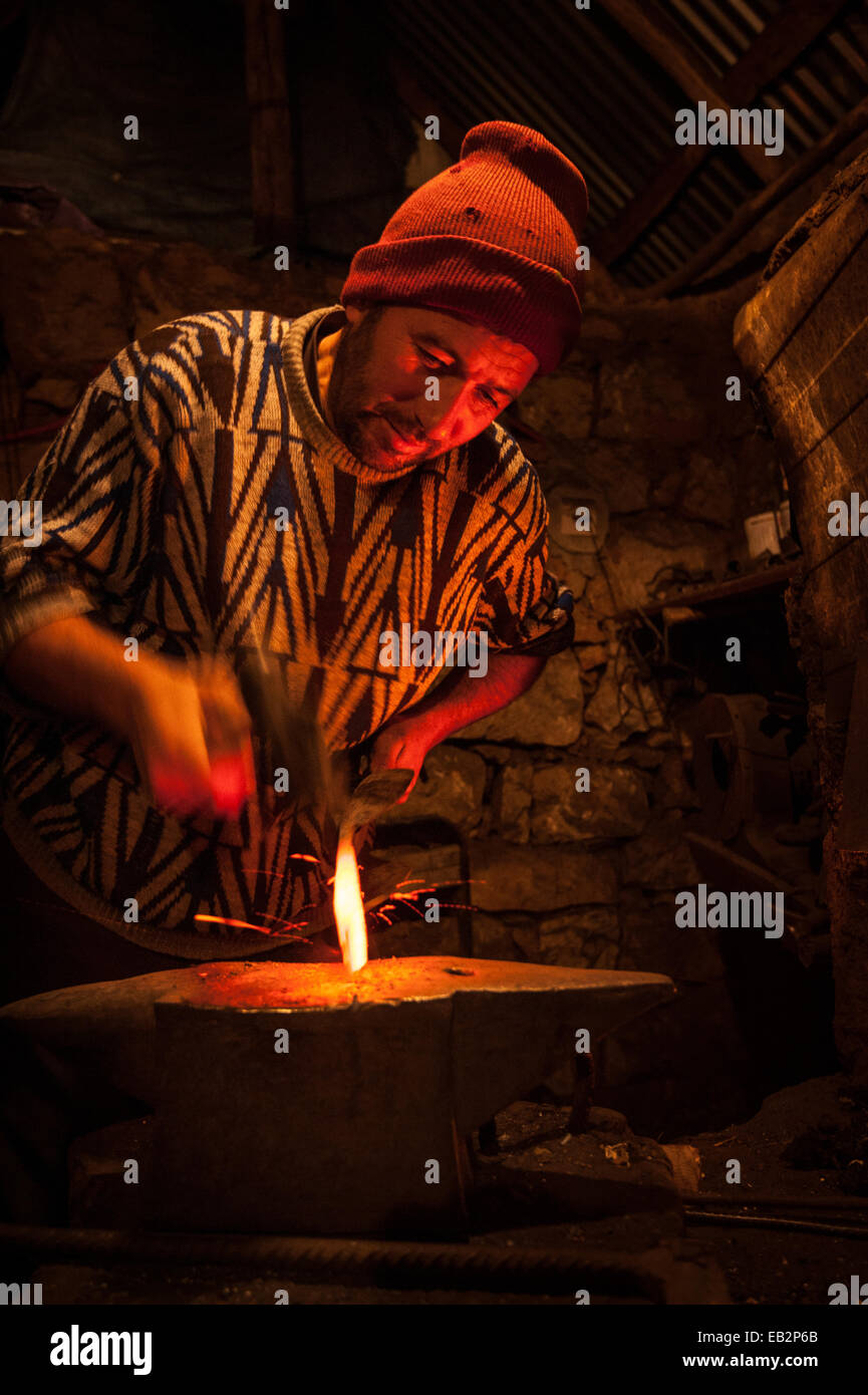 Bouhachem, North Morocco. 24th Nov, 2014. Abdullah, a farrier, shapes a ...